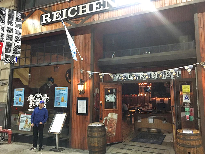 The wooden facade of Reichenbach Hall beckons with its "WILLKOMM" sign, like a warm German hug in the middle of Manhattan's concrete jungle.