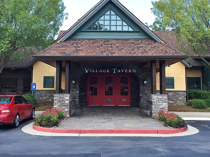 Those iconic red doors beneath the peaked roof aren't just an entrance &ndash; they're a portal to prime rib paradise in suburban Alpharetta.
