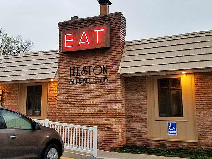 That iconic red "EAT" sign isn't just an invitation – it's a command from the food gods that locals have happily obeyed for generations at this brick-clad treasure.
