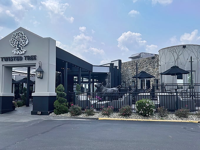 The welcoming facade of Twisted Tree Steakhouse stands proudly against the blue Missouri sky, lantern lights ready to guide hungry pilgrims to beef paradise. 