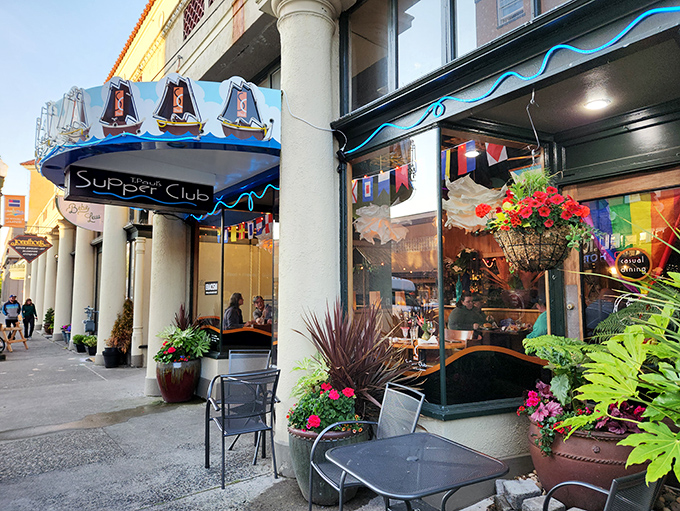 The iconic blue awning with sailboat motifs welcomes you to T. Paul's Supper Club, a coastal gem where Astoria's charm meets culinary excellence. 