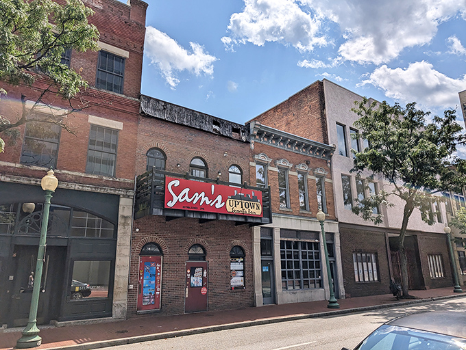 A beacon of flavor in the heart of Charleston! Sam's Uptown Caf&eacute;'s vibrant sign promises a culinary adventure that'll make your taste buds do the Charleston.