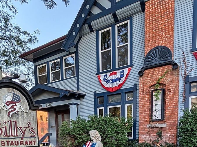 Billy's blue Victorian exterior isn't just charming&mdash;it's a culinary time machine disguised as your fancy aunt's house. The patriotic bunting adds a perfect touch.
