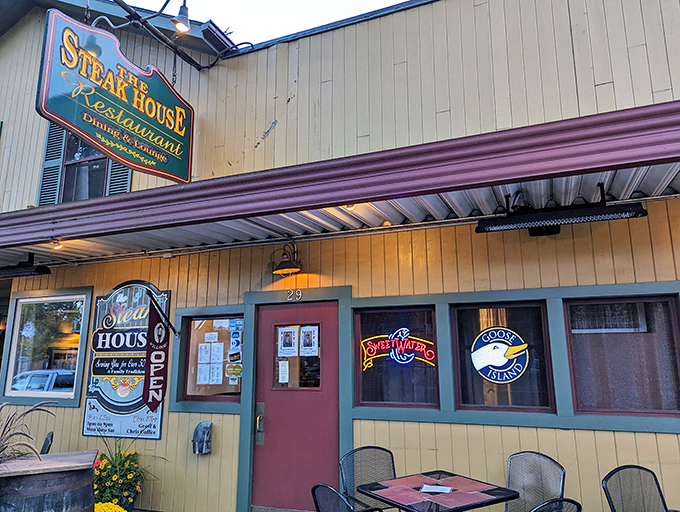 The unassuming yellow exterior hides culinary treasures within, like finding Batman's cave disguised as a suburban home in Wellsboro.