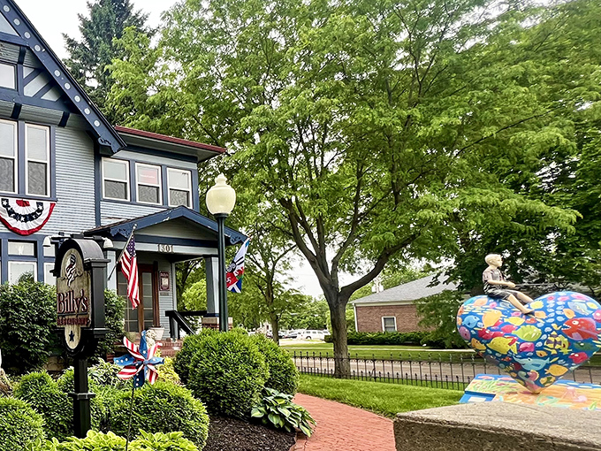 Billy's blue Victorian exterior isn't just charming&mdash;it's a culinary time machine disguised as your fancy aunt's house. The patriotic bunting adds a perfect touch.