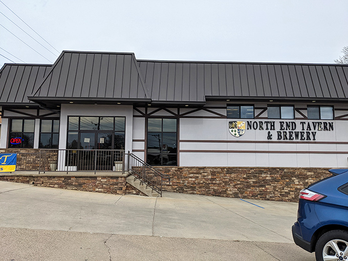 The Tudor-style exterior of North End Tavern & Brewery stands as a welcoming beacon for hungry travelers and thirsty locals alike.