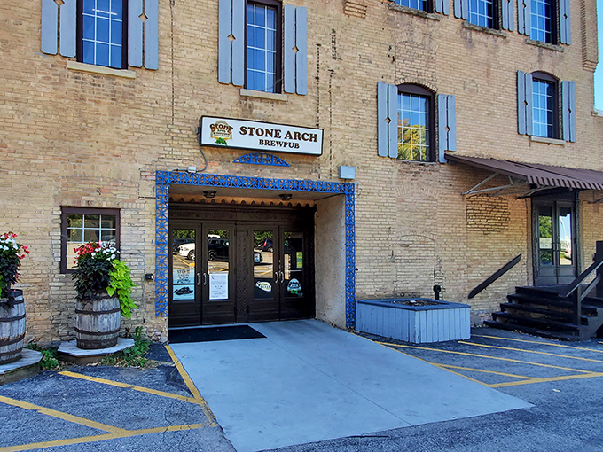 Stone Arch Brewpub's historic brick exterior with blue shutters stands as Appleton's answer to "where should we eat tonight?" Timeless charm meets modern craft brewing.