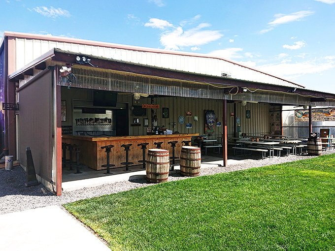 The ultimate "don't judge a book by its cover" moment. This unassuming metal building houses liquid gold under that brilliant New Mexico sky.