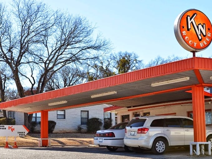 The unassuming exterior of K N Root Beer Drive In proves once again that Texas's greatest culinary treasures often hide in plain sight.