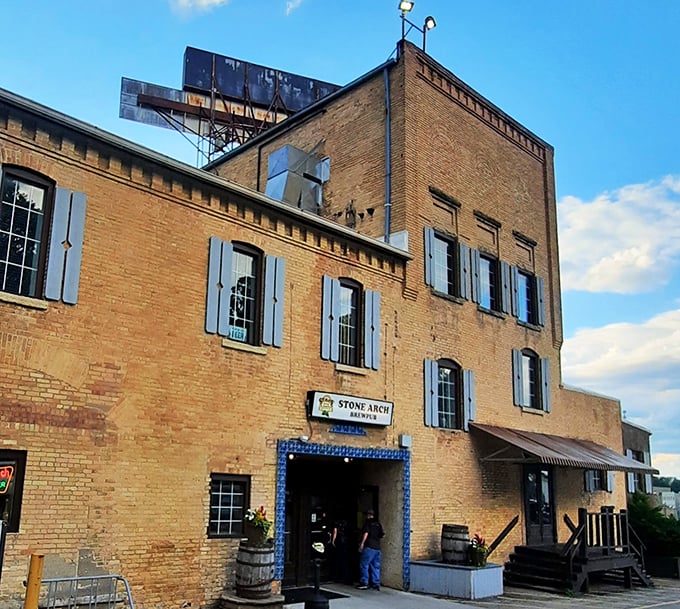 Stone Arch Brewpub's historic brick exterior with blue shutters stands as Appleton's answer to "where should we eat tonight?" Timeless charm meets modern craft brewing.
