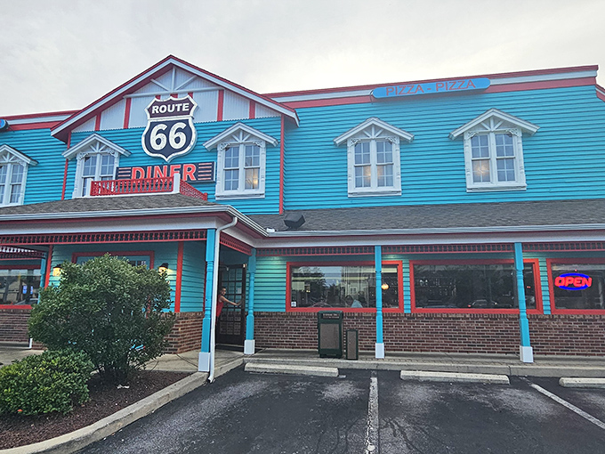 The turquoise beacon of Route 66 Diner stands out against the Maryland sky like a time portal to the 1950s, beckoning hungry travelers with its nostalgic charm.