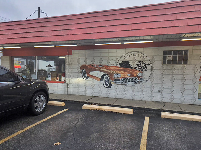 Welcome to time travel central! Rock-Cola's distinctive red roof and vintage car mural aren't just decoration&mdash;they're your first clue you've stumbled upon something special on Indy's east side.