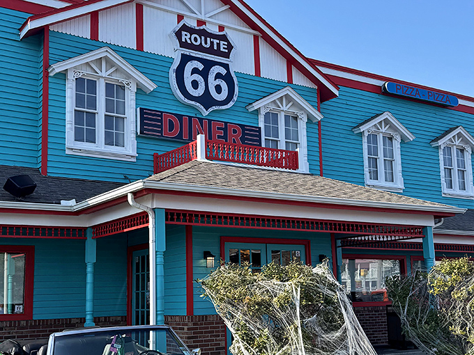 The turquoise beacon of Route 66 Diner stands out against the Maryland sky like a time portal to the 1950s, beckoning hungry travelers with its nostalgic charm.