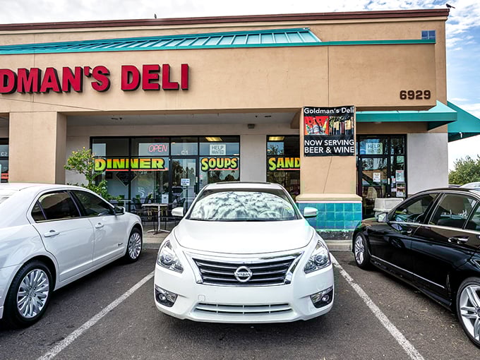 The bright red sign of Goldman's Deli stands out like a beacon of hope for the hungry and homesick. Comfort food paradise awaits!