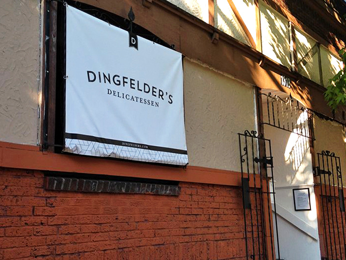 The red brick facade of Dingfelder's stands like a portal to deli nirvana, promising authentic flavors that transport you straight to the Lower East Side.