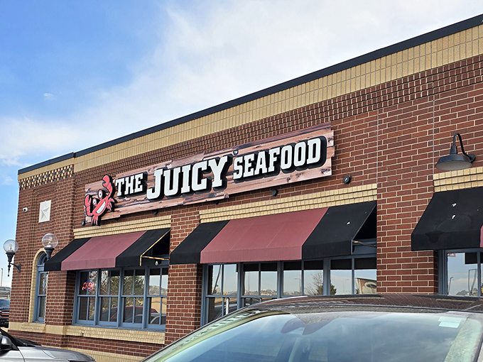 The brick facade of The Juicy Seafood stands like a culinary lighthouse in Colorado Springs, promising oceanic treasures within its unassuming exterior.