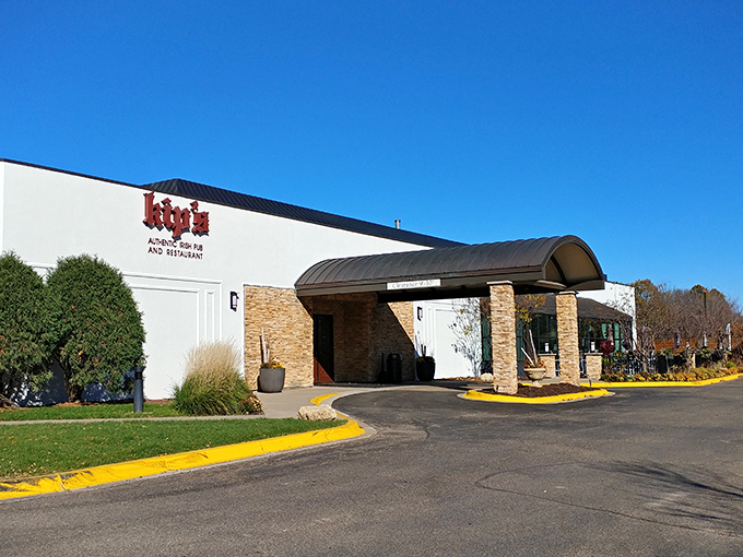 The welcoming stone entrance of Kip's Irish Pub stands ready to rescue you from Minnesota winters with its promise of warmth and hearty fare inside.