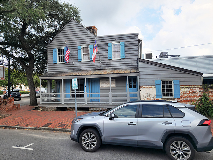 The historic blue-shuttered facade of The Pirates' House stands as a Georgian time capsule, welcoming hungry travelers just as it has since 1753.