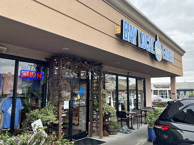 The unassuming exterior hides culinary treasures within. Like finding a pearl in an oyster, Bay Local Eatery's strip mall location belies the seafood magic happening inside.
