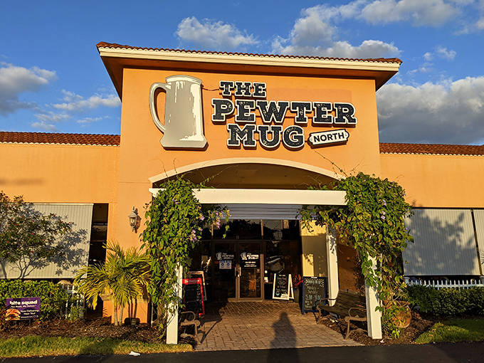 The Pewter Mug North stands proud against the Florida sky, American flags waving a patriotic welcome to hungry visitors.