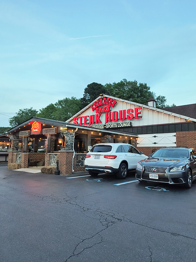 The iconic red lettering of Aberdeen Barn beckons like a lighthouse for hungry souls. This barn-shaped beacon has been guiding steak lovers to beefy bliss for generations.