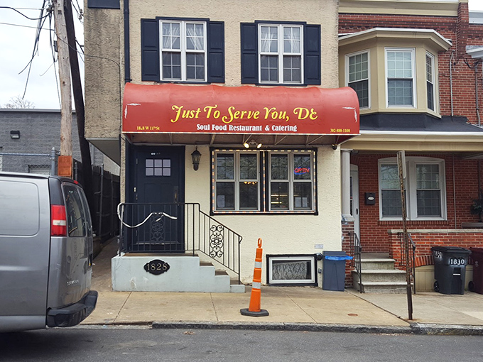 The unassuming storefront with its bright red awning promises culinary treasures within. Like finding a rare vinyl record, the joy is in the discovery.