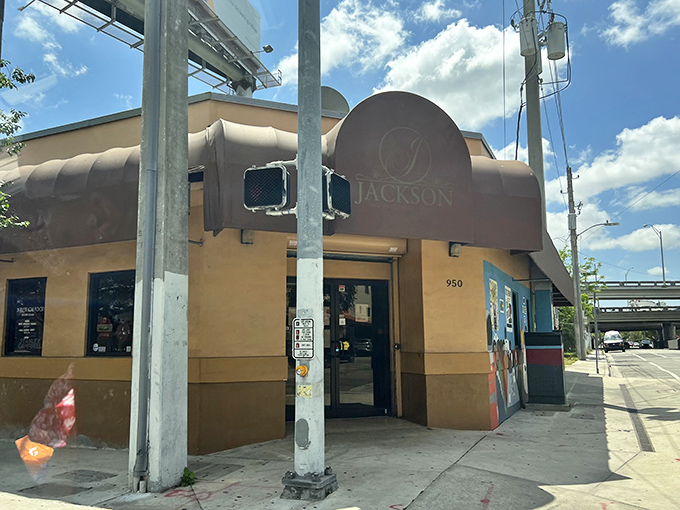 The unassuming exterior of Jackson Soul Food stands like a culinary lighthouse in Overtown, beckoning hungry travelers with promises of Southern comfort.