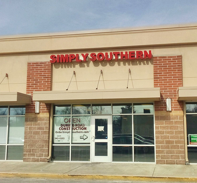 The bright red signage beckons like a lighthouse for hungry souls. Simply Southern's modest exterior hides culinary treasures waiting to be discovered.