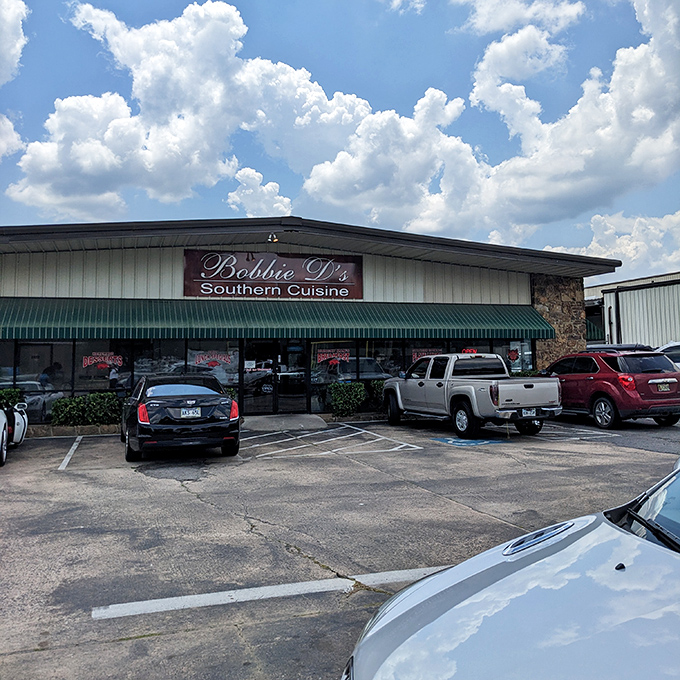 The unassuming exterior of Bobbie D's Southern Cuisine might not scream "culinary destination," but that green awning signals delicious treasures await inside.