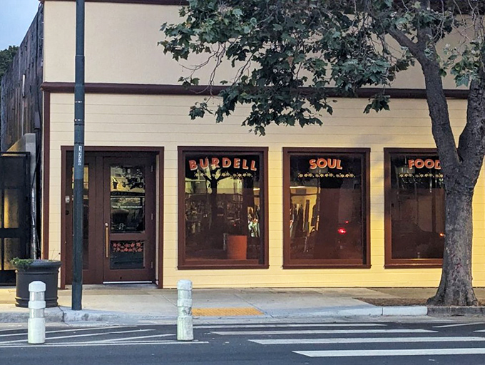 The unassuming cream exterior of Burdell belies the culinary magic happening inside. Like finding a secret doorway to flavor paradise in Oakland.