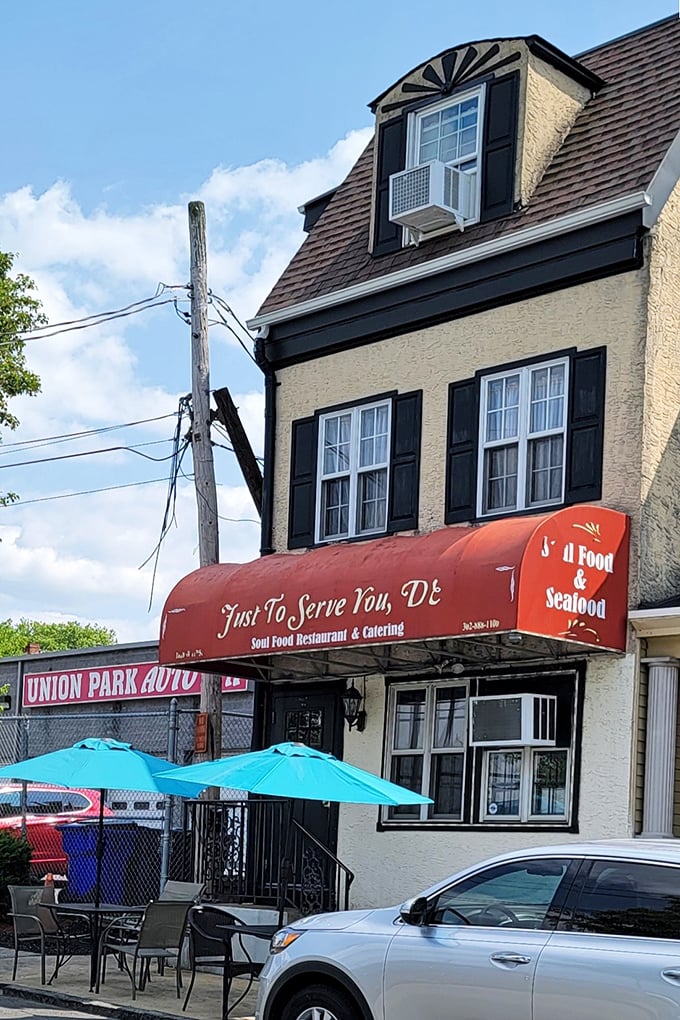 The unassuming storefront with its bright red awning promises culinary treasures within. Like finding a rare vinyl record, the joy is in the discovery.