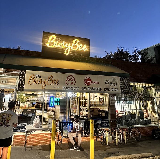The iconic yellow Busy Bee sign beckons hungry souls like a soul food lighthouse on Atlanta's MLK Drive. History and flavor await inside.
