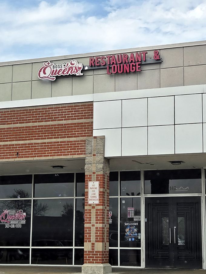The modern brick-and-glass exterior of Boss Queens might look unassuming, but inside awaits a soul food revelation worth crossing state lines for.