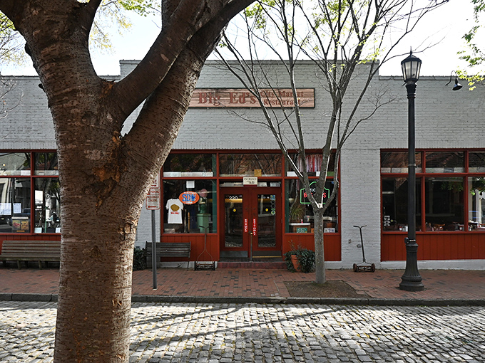 Big Ed's mint-green exterior with red-trimmed windows might not scream "culinary destination," but locals know this unassuming facade hides Southern food paradise inside.