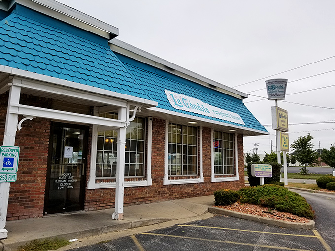 The iconic turquoise roof of La Gondola stands out like a pasta-lover's lighthouse, beckoning hungry travelers with promises of spaghetti salvation in Decatur.