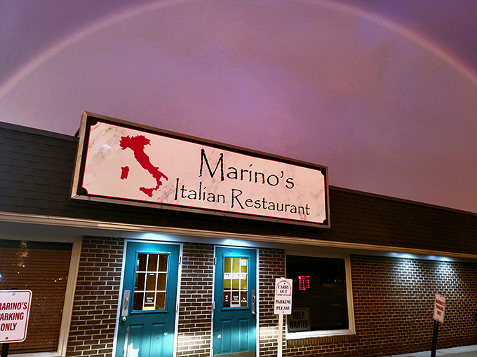 The unassuming exterior of Marino's, with its turquoise door and boot-shaped Italian sign, proves that culinary treasures often hide in the most modest packages.