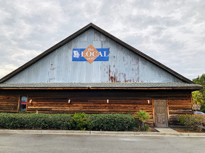 The rustic charm of The Local on 17 beckons from the roadside like a siren song for steak lovers. That weathered wood exterior hides culinary treasures within.