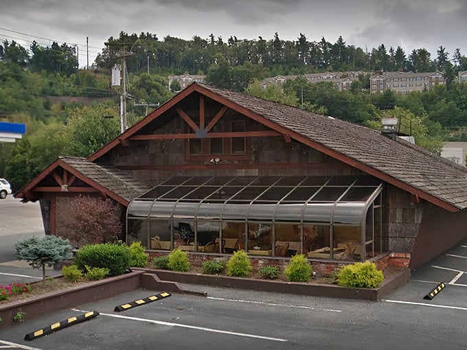 The rustic cabin exterior with its weathered shingles and iconic 1972 entrance doesn't just whisper "come in" &ndash; it practically shouts "carnivorous nirvana awaits!"