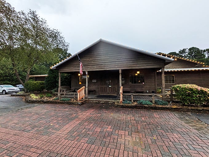 Rustic charm meets carnivore's paradise at this unassuming wooden cabin. The brick pathway practically whispers, "Follow me to steak nirvana."