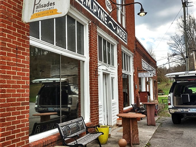 The historic O.M. Pyne building stands as a culinary time machine in tiny Eggleston. Red brick, weathered benches, and small-town charm set the stage for an extraordinary meal.