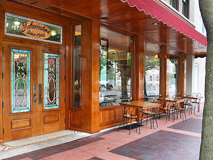 Step back in time with Zaharakos' stunning wooden fa&ccedil;ade &ndash; where the red awnings aren't just decorative, they're practically inviting you in for a sweet escape.