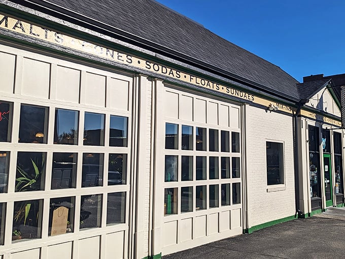 The charming white brick exterior of Ted & Wally's stands as a beacon of sweet promises in Omaha's Old Market district, complete with colorful ice cream cone decorations. 