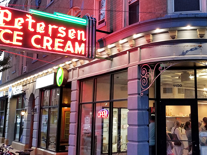 That neon sign doesn't just advertise ice cream&mdash;it's a beacon of hope on a tough day and a promise of something wonderful around that curved corner entrance.
