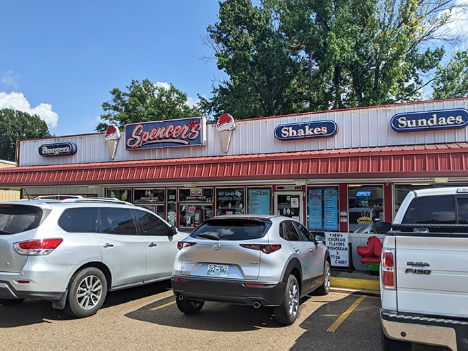 The classic red and white exterior of Spencer's Dairy Kream stands as a beacon of sweet nostalgia in Grenada, promising frozen delights that have stood the test of time.