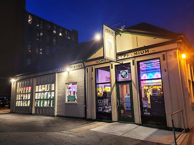 The charming white brick exterior of Ted & Wally's stands as a beacon of sweet promises in Omaha's Old Market district, complete with colorful ice cream cone decorations. 