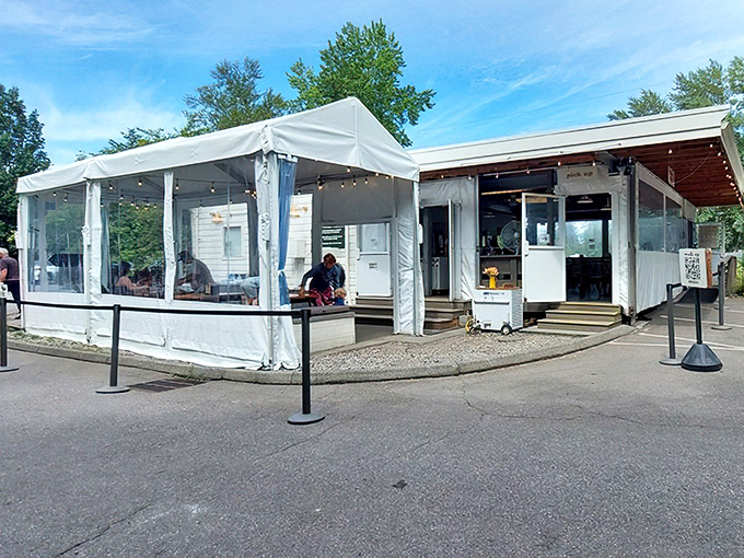 Sugarpine Drive-In's classic white exterior beckons like a mirage in the Oregon wilderness. Nostalgia with a modern twist awaits. 