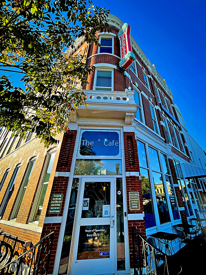 The corner brick building stands like a sentinel of sweetness, promising cold comfort on hot Arkansas afternoons with its classic soda fountain charm.