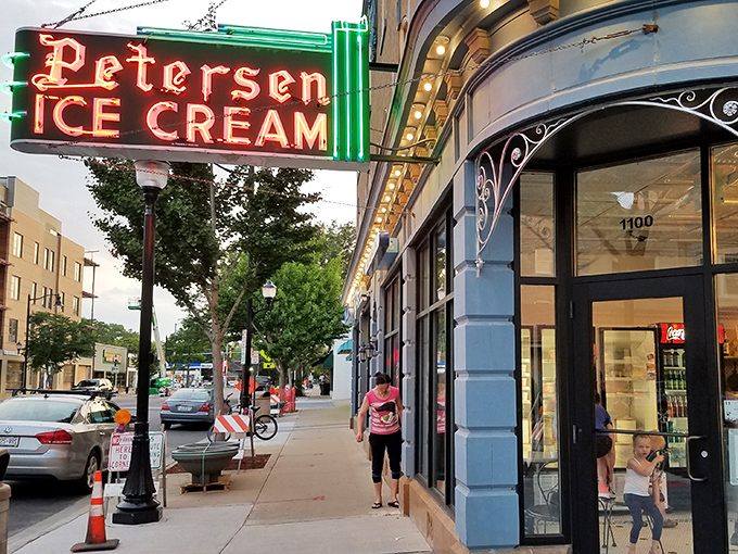 That neon sign doesn't just advertise ice cream&mdash;it's a beacon of hope on a tough day and a promise of something wonderful around that curved corner entrance.