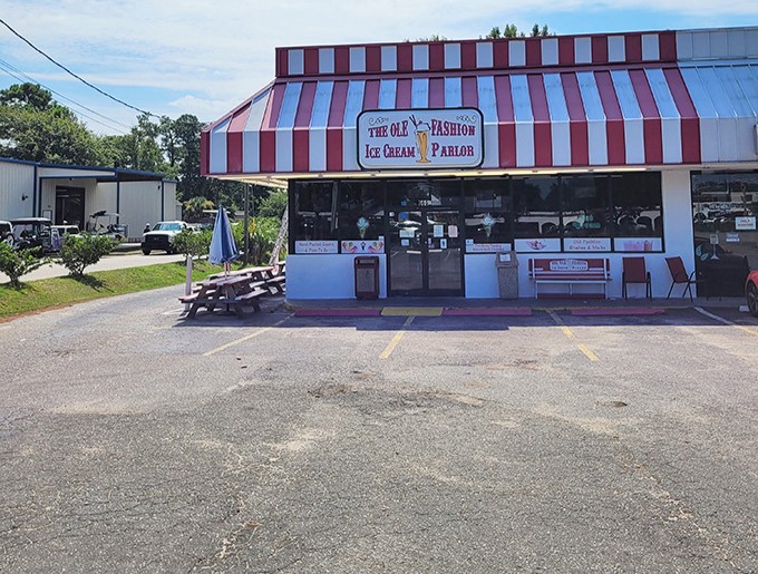 The red and white striped awning isn't just eye-catching&mdash;it's the universal signal that serious ice cream happiness awaits inside. No filter needed on this classic Americana.