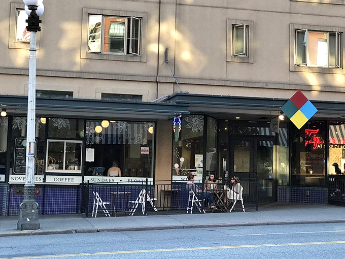 The mint-green sign beckons like a lighthouse for sweet-tooth sailors. Shug's classic storefront promises "SUNDAES FLOATS" in lettering that screams "your diet ends here."